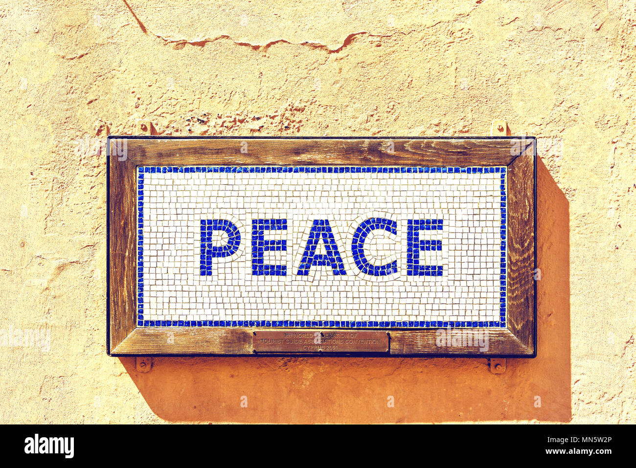 Daylight view to famous peace sign on yellow wall Stock Photo - Alamy