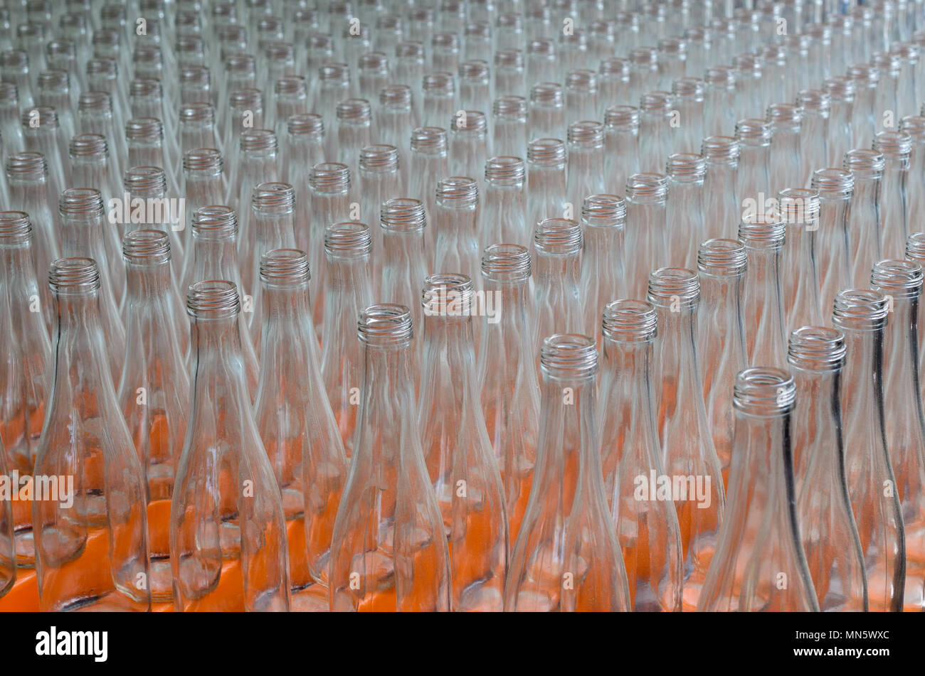 Many empty translucent bottles in a row are perspective Stock Photo - Alamy