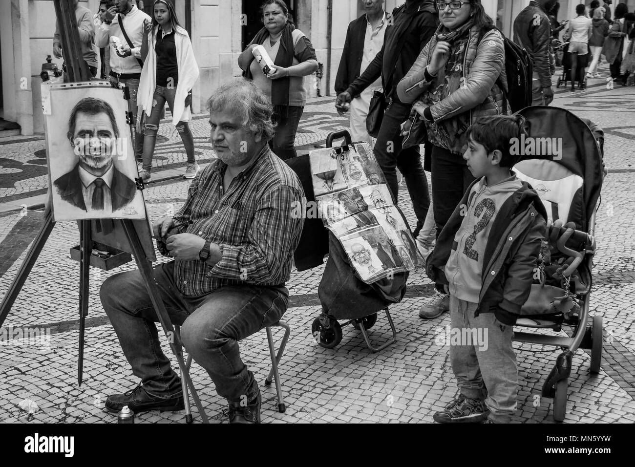 Street artist drawing caricatures hi-res stock photography and images ...