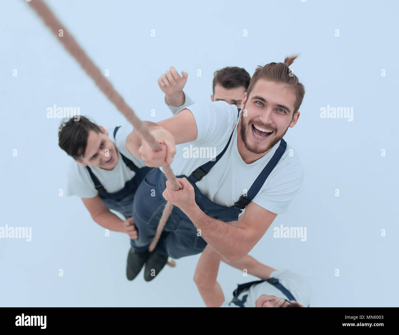 view from the top.smiling engineer ,climbing up the rope Stock Photo ...