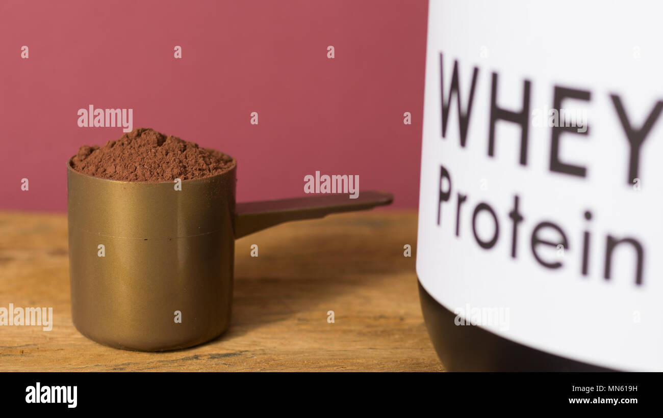 Whey protein powder sports bodybuilding supplement. Close up of scoop ...