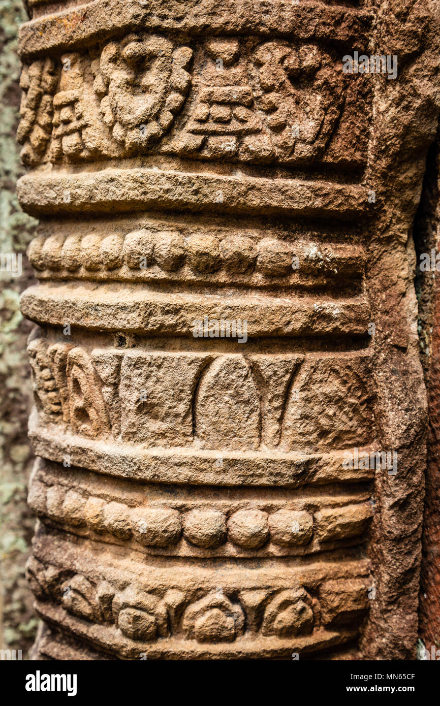 Stone carved poles of Vat Phou religious complex in Champasak province ...
