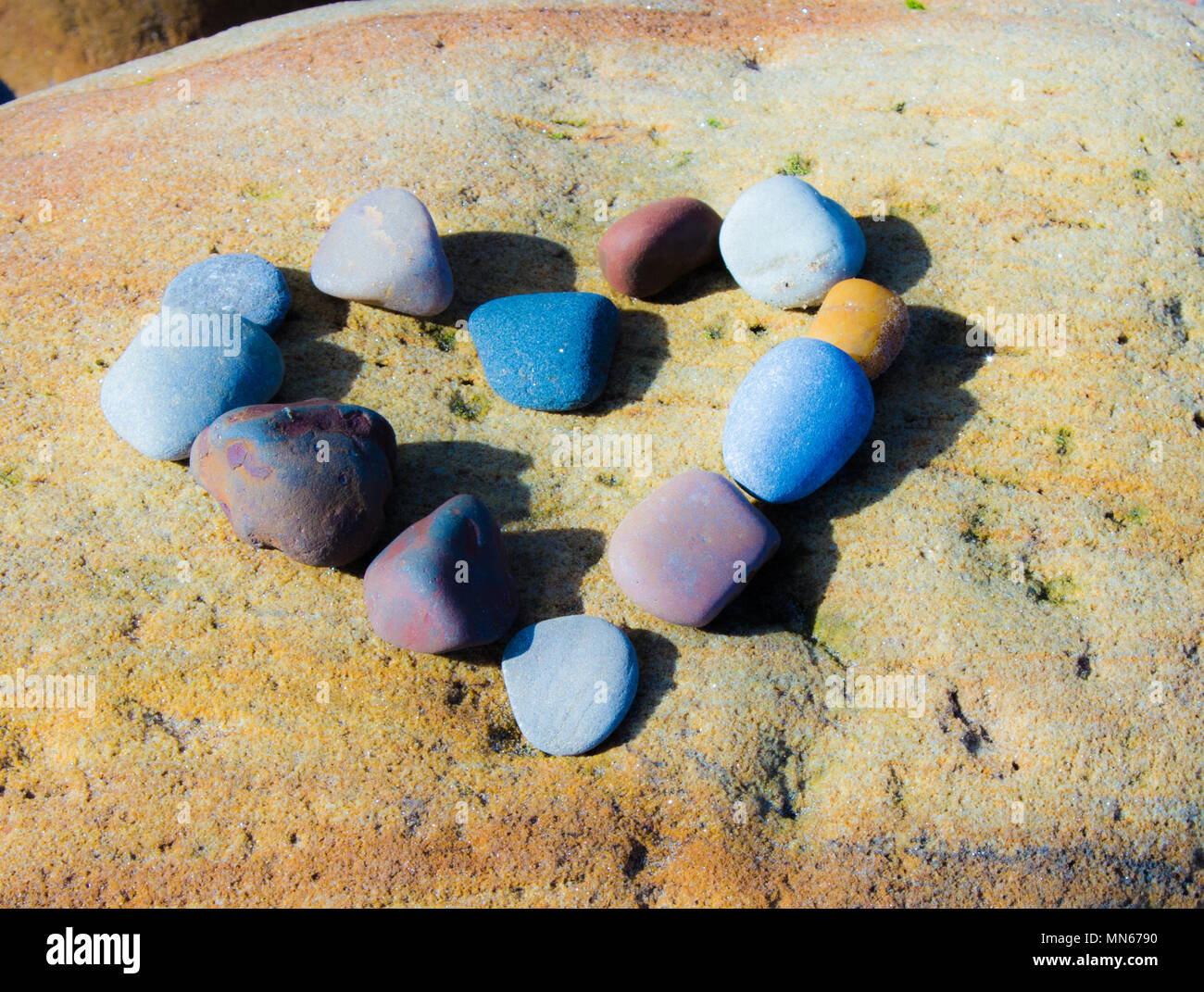 Stone heart love messages by the beach Stock Photo - Alamy