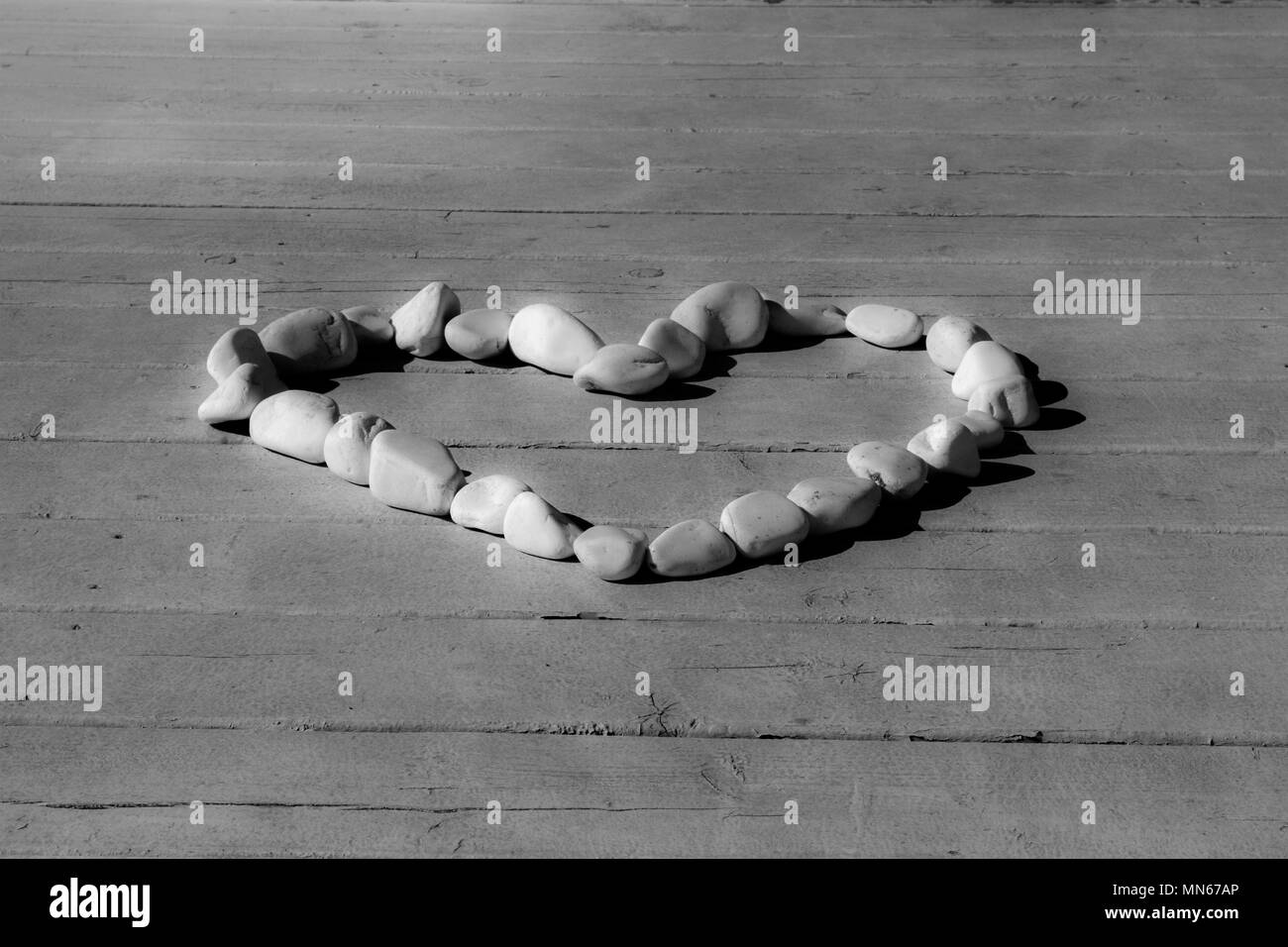 Stone heart love messages by the beach Stock Photo - Alamy