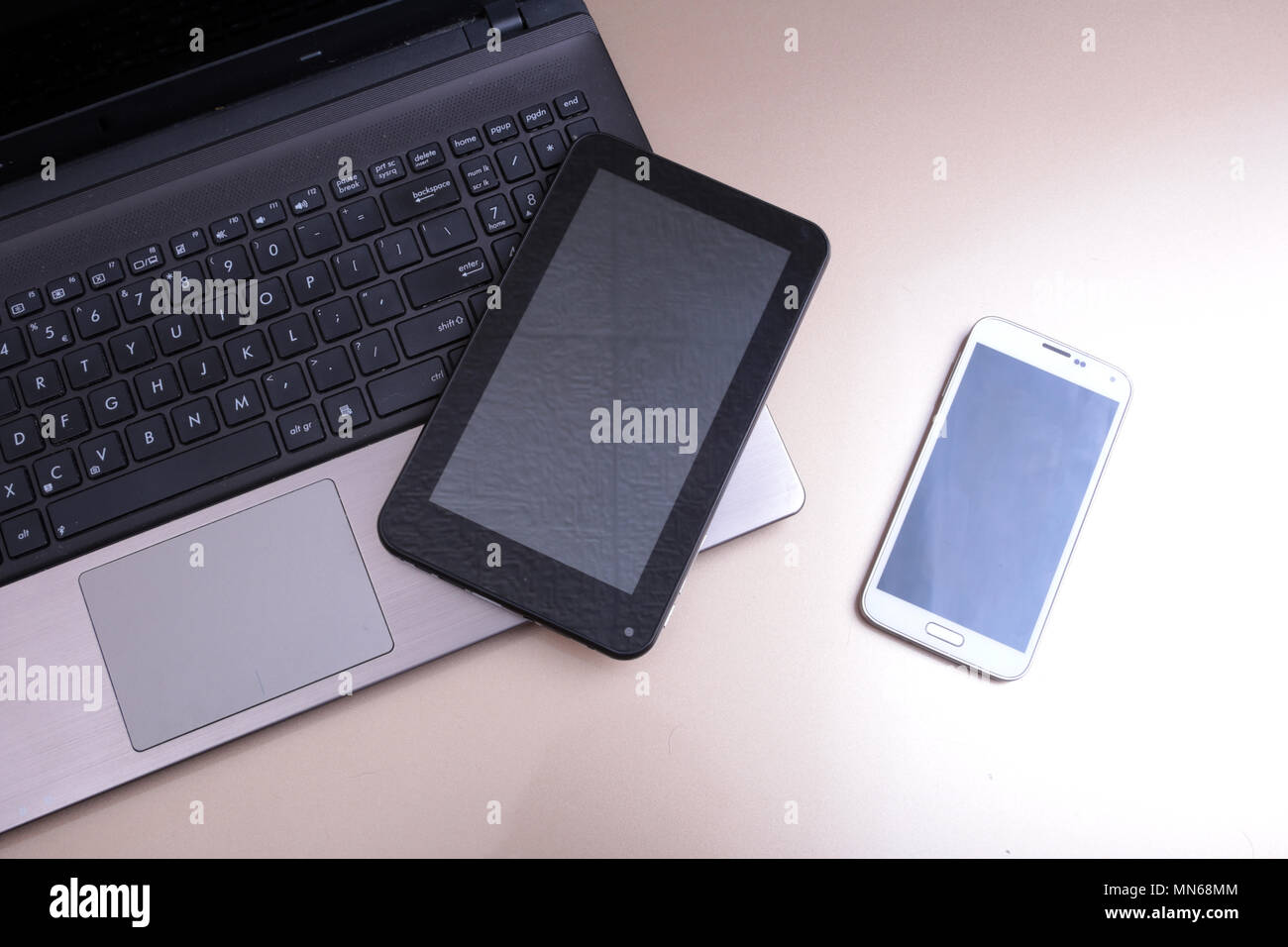 Office workplace with laptop, smart phone on table Stock Photo - Alamy