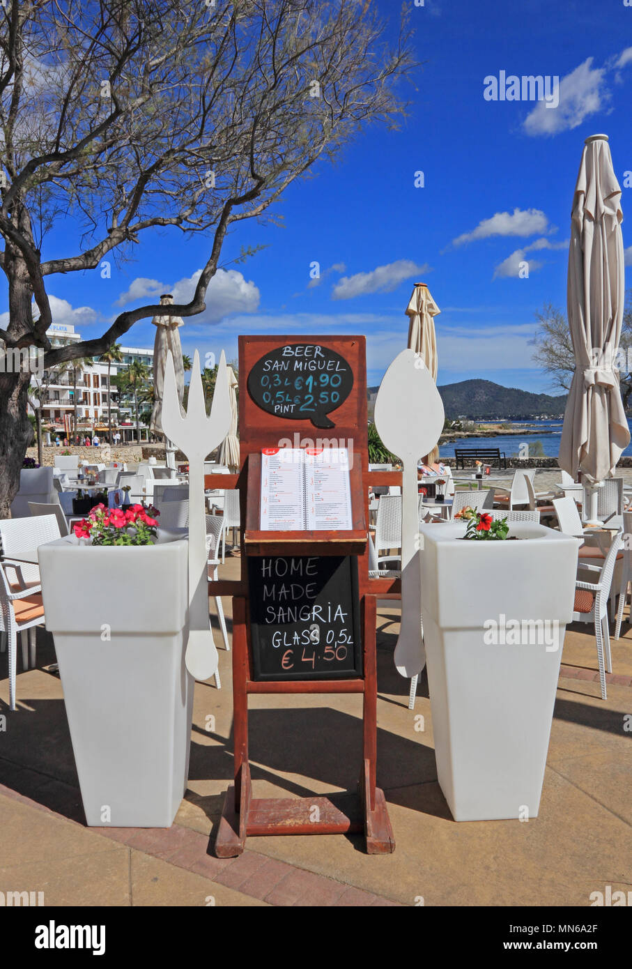 Menu stand outside seafront restaurant, Cala Millor, Mallorca Stock ...