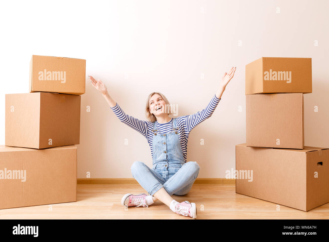 Picture of young woman with cardboard box Stock Photo - Alamy