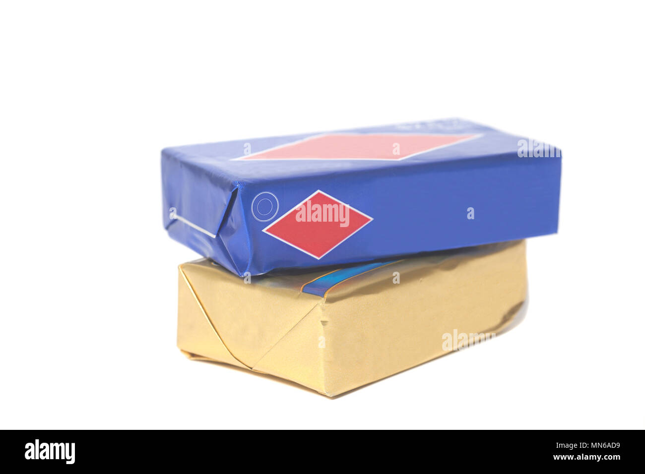 Sticks of wrapped butter isolated on white background Stock Photo - Alamy