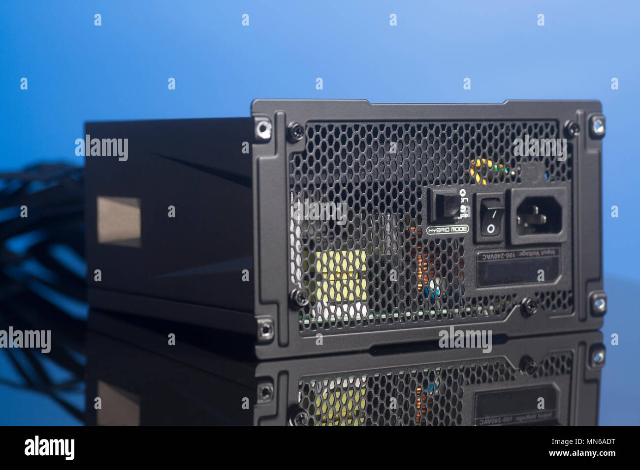 Computer Power Supply Unit with cable on blue background Stock Photo ...