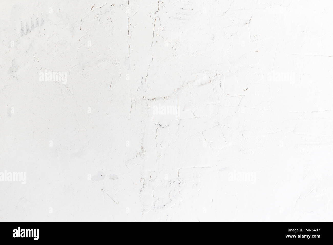 Textured ragged white wall plaster, after taking out tile. The wall ...