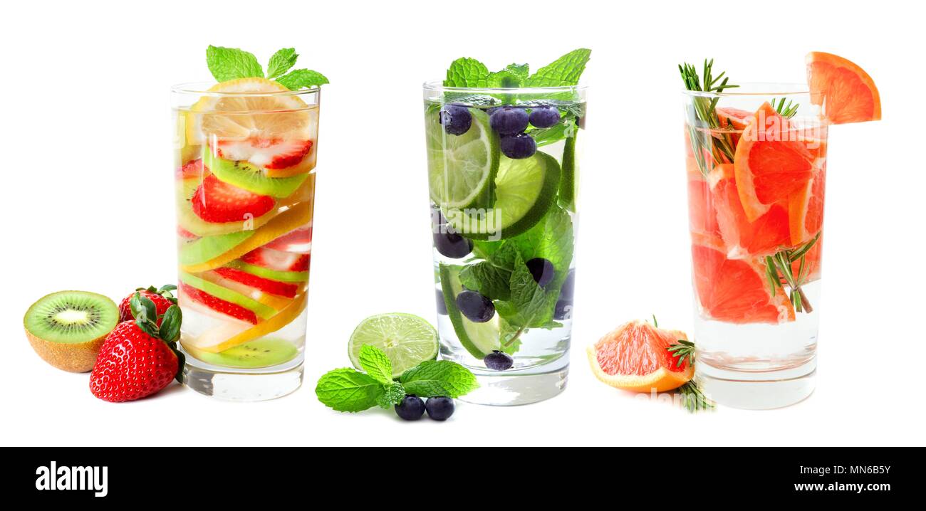 Three types of fruit infused water in glasses isolated on a white ...