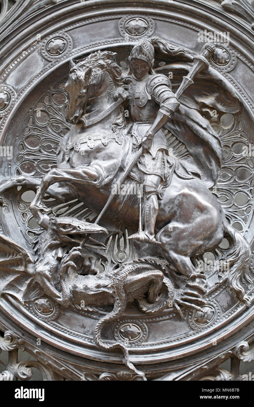 A relief of Saint George slaying a dragon on the door of a tomb in the ...