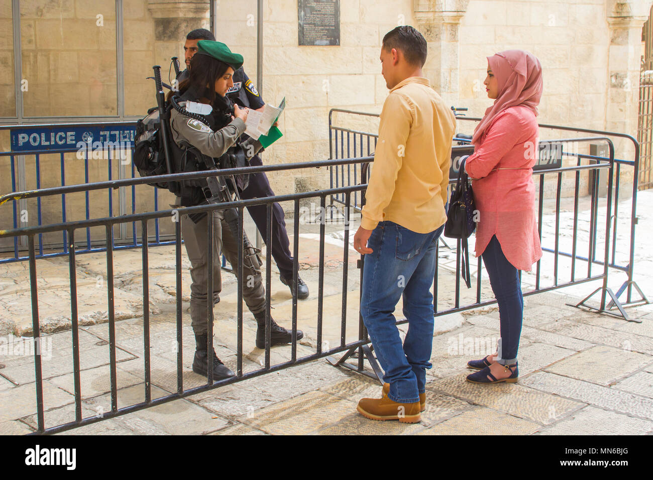 Via Dolorosa Jerusalem Israel A young Israeli policeman and woman check ...