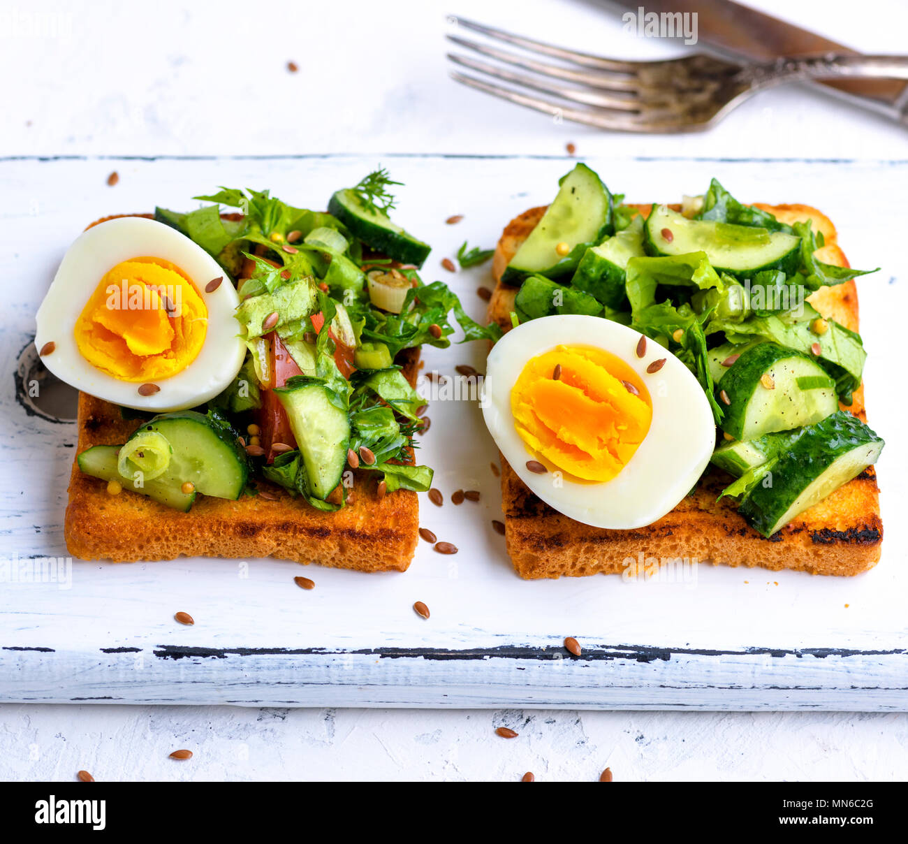 toasted square pieces of bread from white wheat flour with boiled egg ...