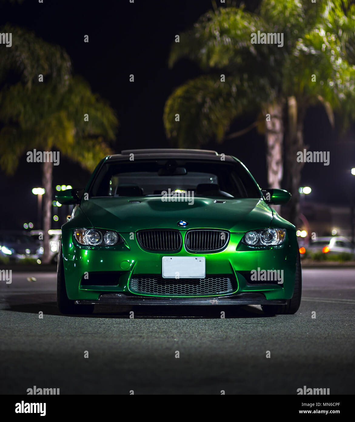 Green BMW facing front at night time Stock Photo - Alamy