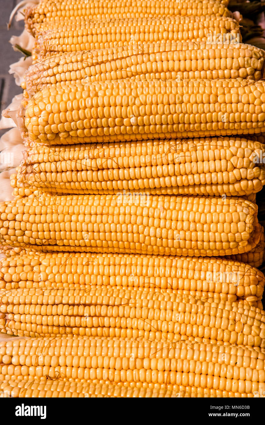 Raw Corns on the stall Stock Photo - Alamy