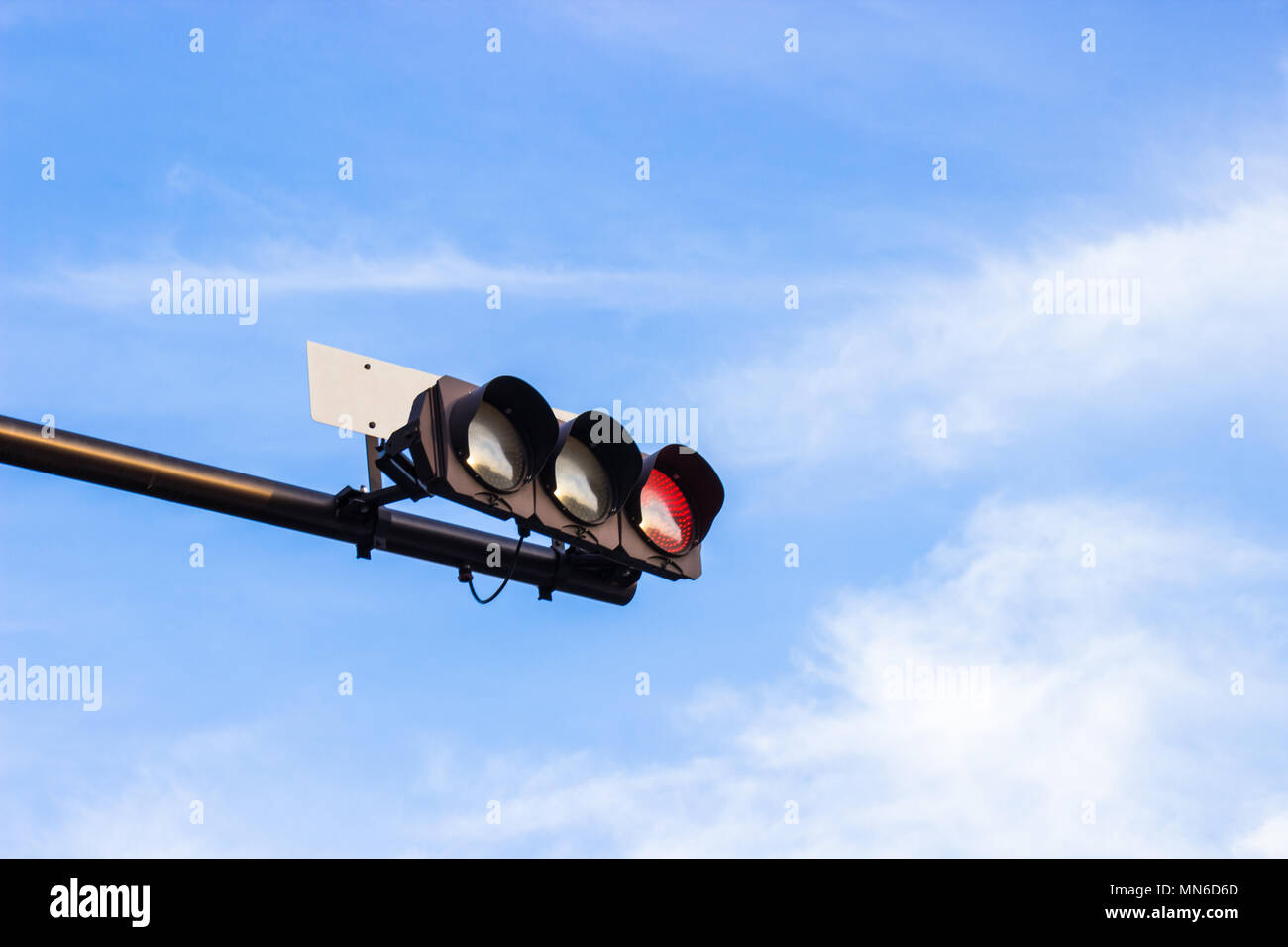 Red traffic light signals in japan with bright blue sky background ...