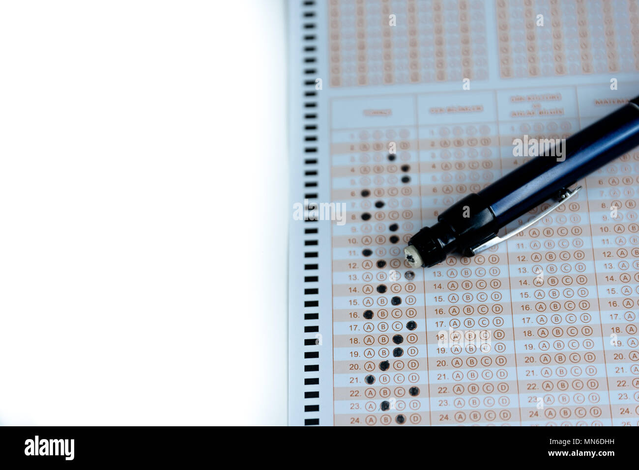 Erasing answer with pencil on Test score sheet with answers.Copy space ...