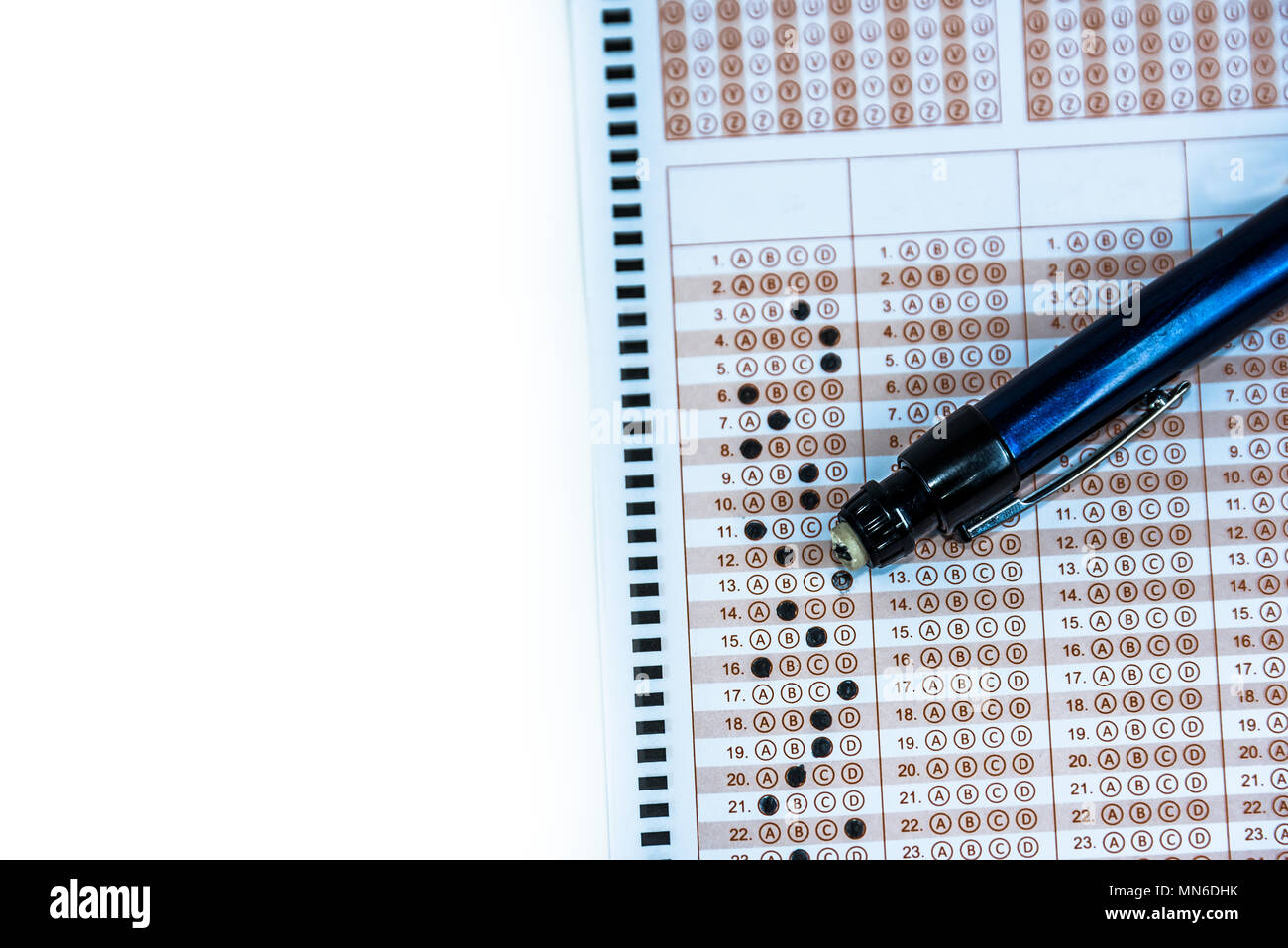 Erasing answer with pencil on Test score sheet with answers.Copy space ...