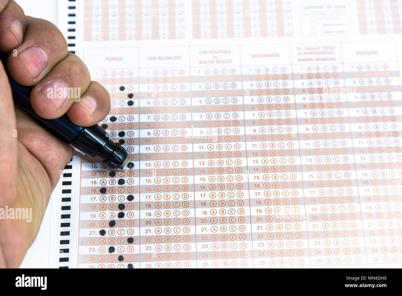 Man hand Erasing answer with pencil on Test score sheet with answers ...