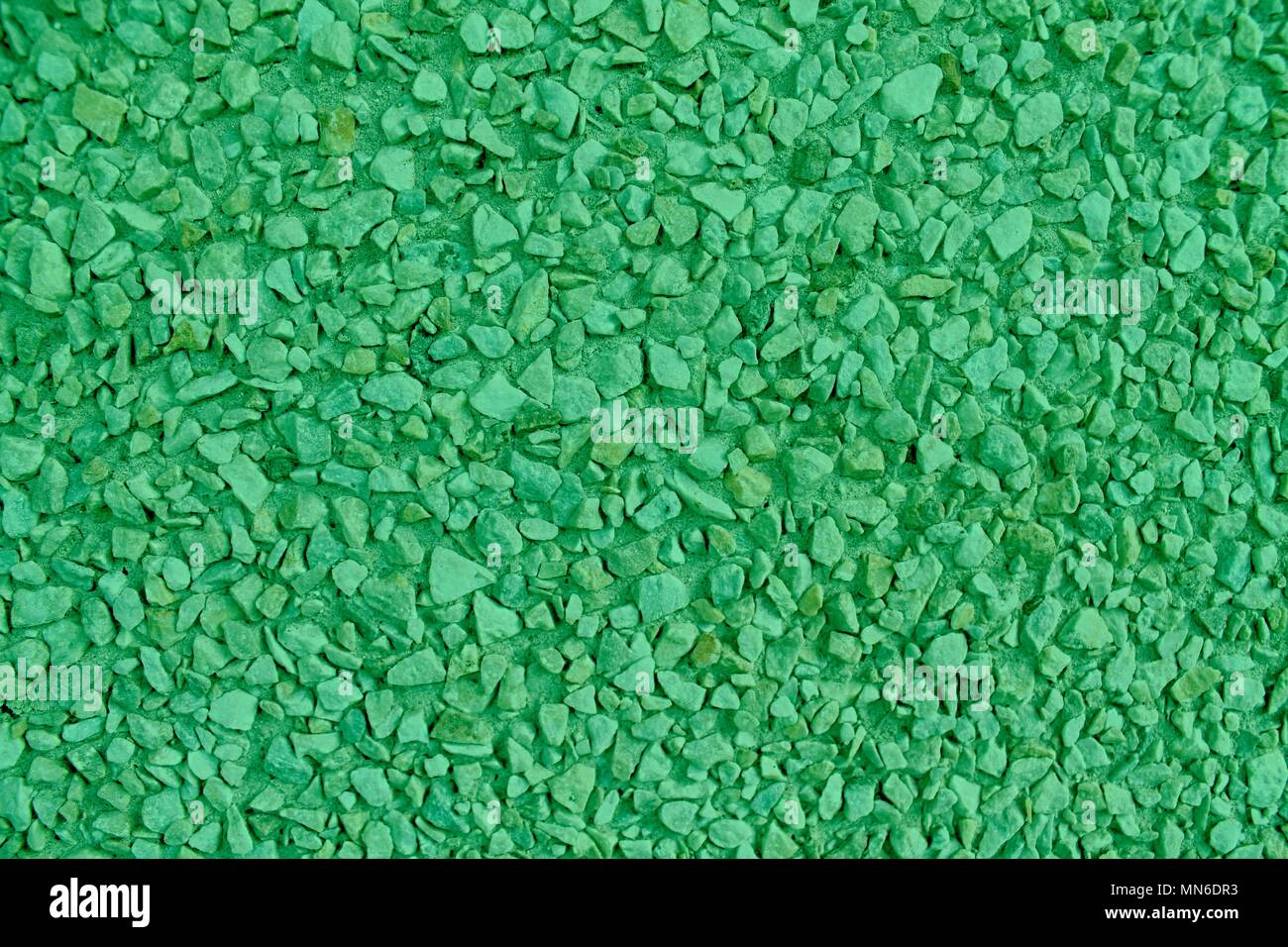 Ultra green Pebble textured surface, stone backdrop and boulder ...