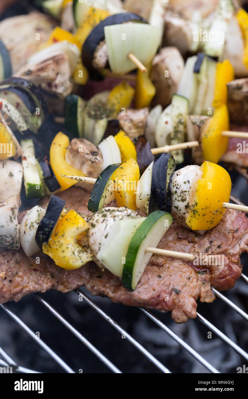 barbecue with delicious grilled meat and vegetables on grill Stock ...