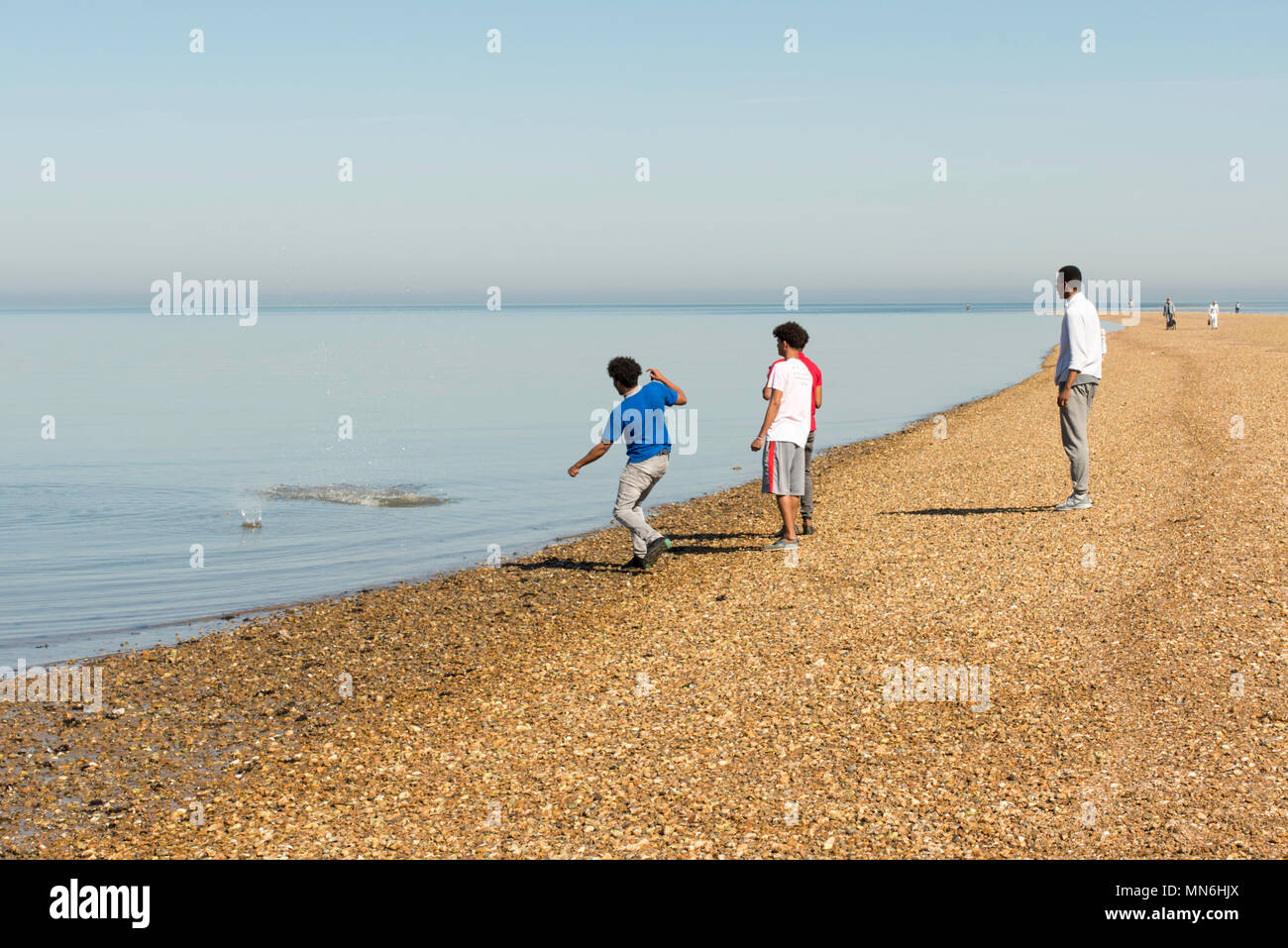 Friends enjoying a day on the beach at Tankerton, near Whitstable, Kent ...