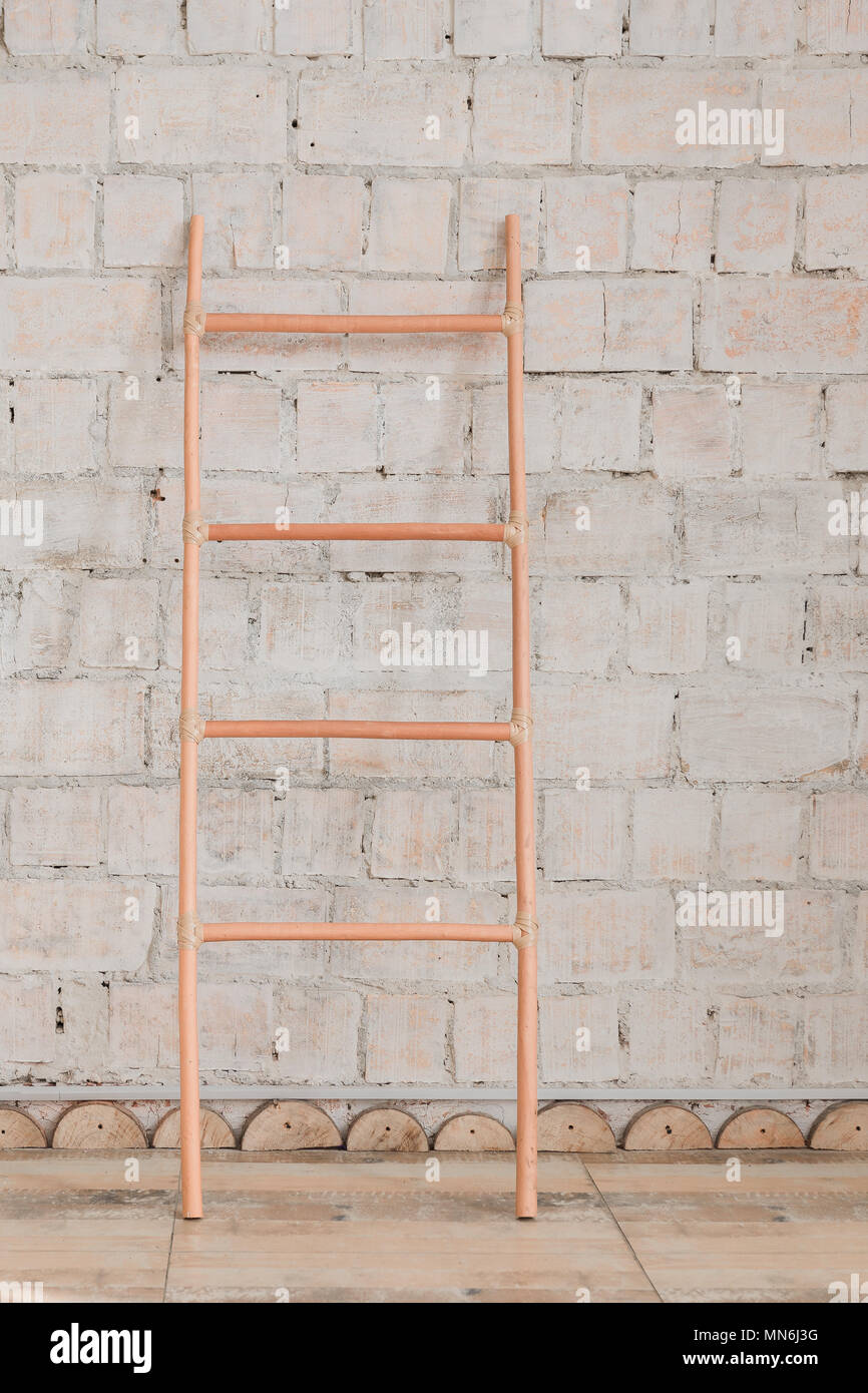 Ladder for clothes in a loft style of wood Stock Photo - Alamy
