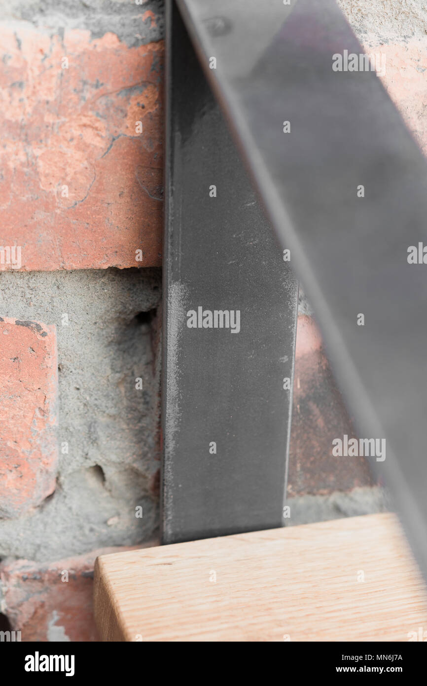 Shelf in wood and metal hanging on a brick wall in loft style Stock ...