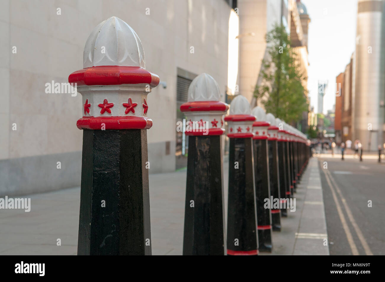 Bollards along a footpath to prevent parking in London Stock Photo - Alamy