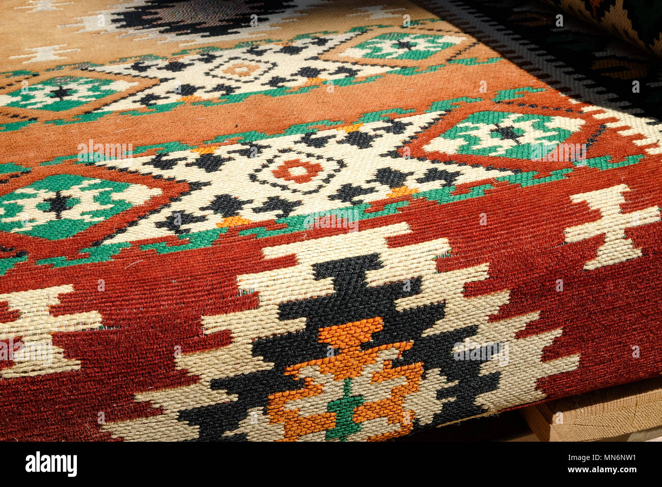 Traditional handcrafted colored carpet Stock Photo - Alamy