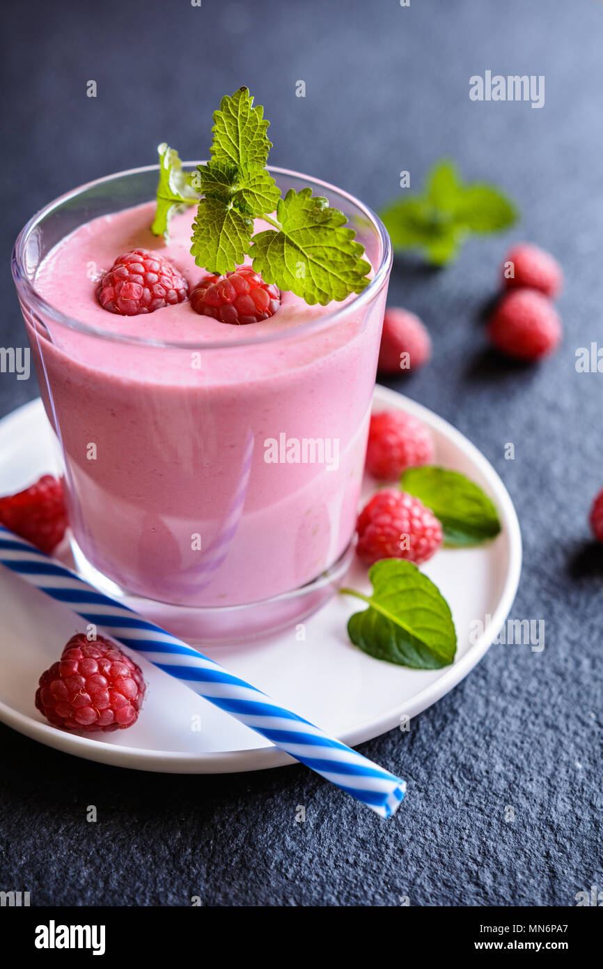 Glass of refreshing raspberry milkshake for breakfast Stock Photo - Alamy