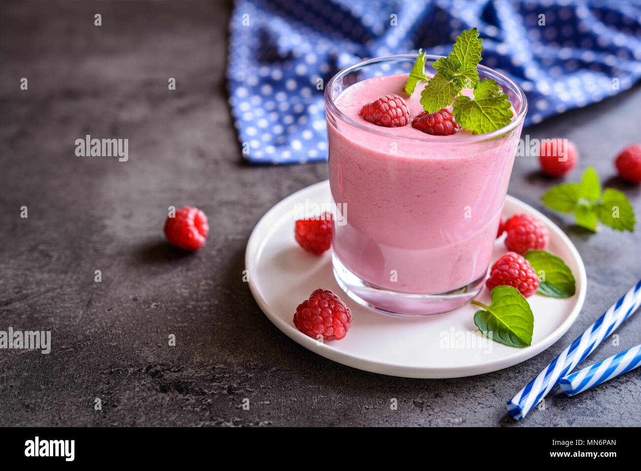 Glass of refreshing raspberry milkshake for breakfast Stock Photo - Alamy