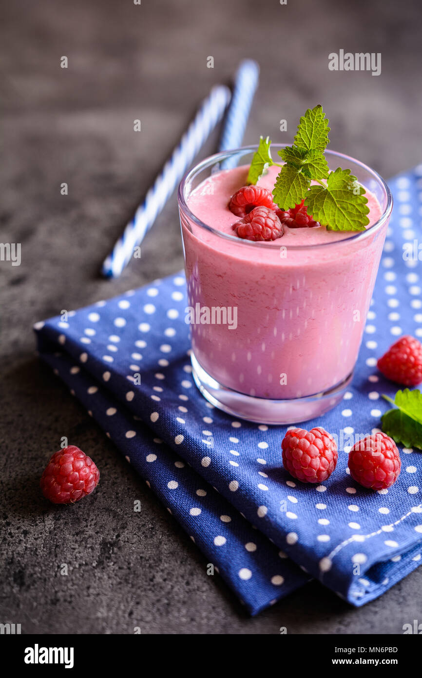 Glass of refreshing raspberry milkshake for breakfast Stock Photo - Alamy