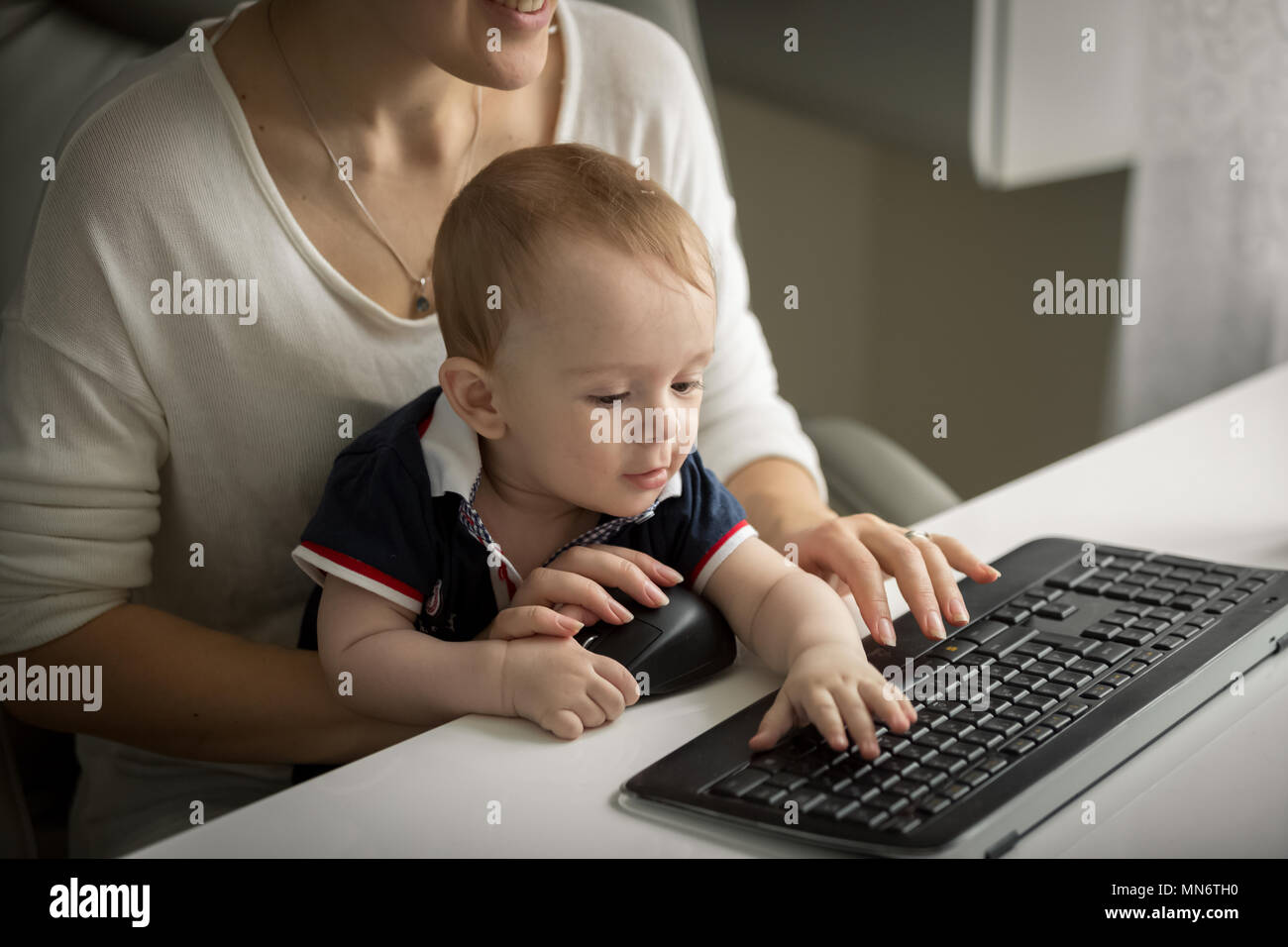 Baby behind desk hi-res stock photography and images - Alamy