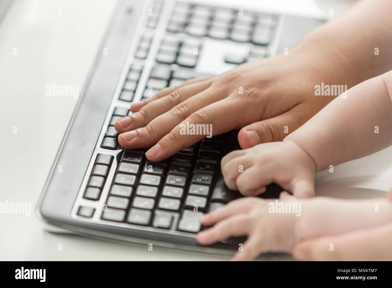 Infant boy computer keyboard hi-res stock photography and images - Alamy