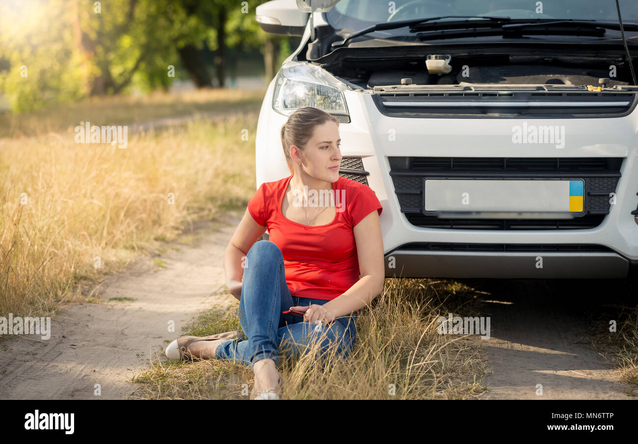 Girl sitting on car bonnet hi-res stock photography and images - Alamy