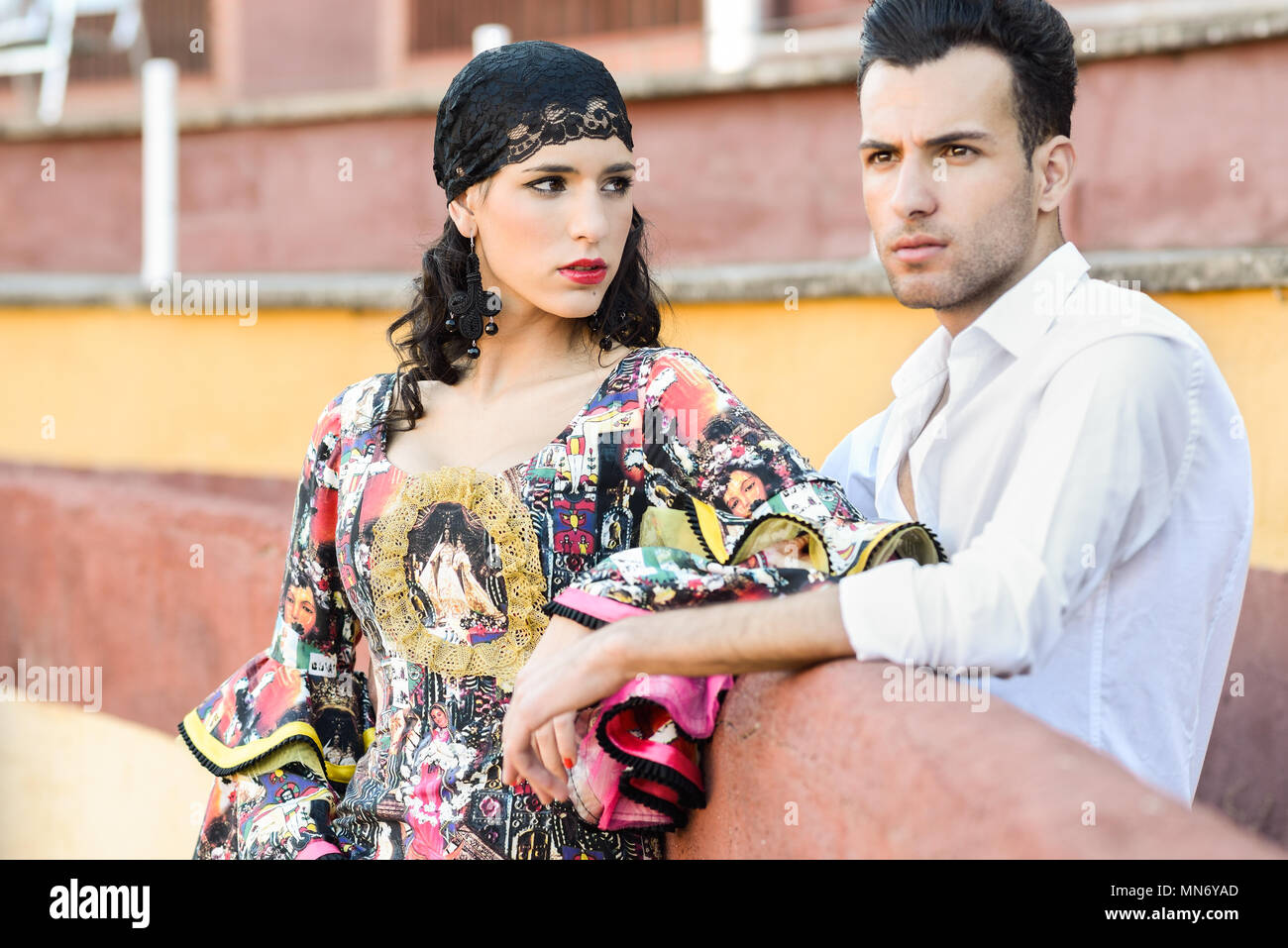 Portrait of a pretty couple, models of fashion, in a bullring. Spanish ...