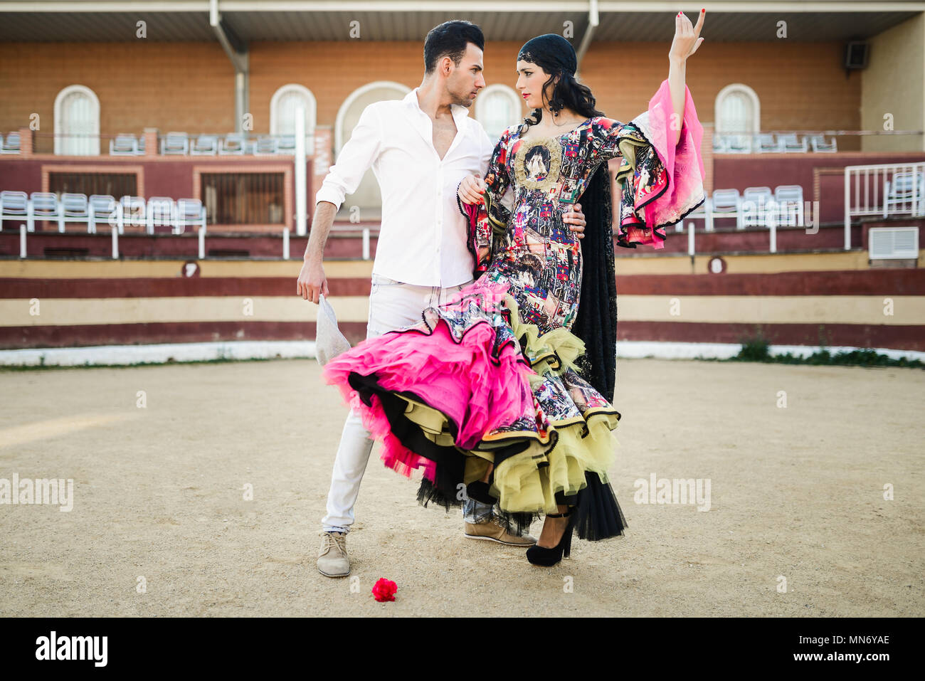 Portrait of a pretty couple, models of fashion, in a bullring. Spanish ...