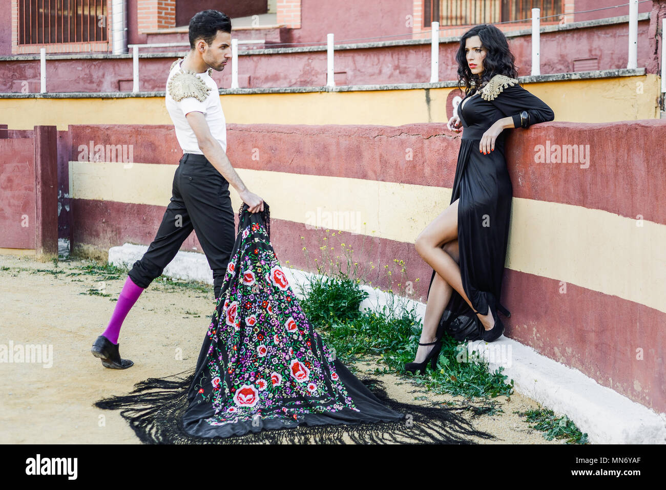 Portrait of a pretty couple, models of fashion, in a bullring. Spanish ...
