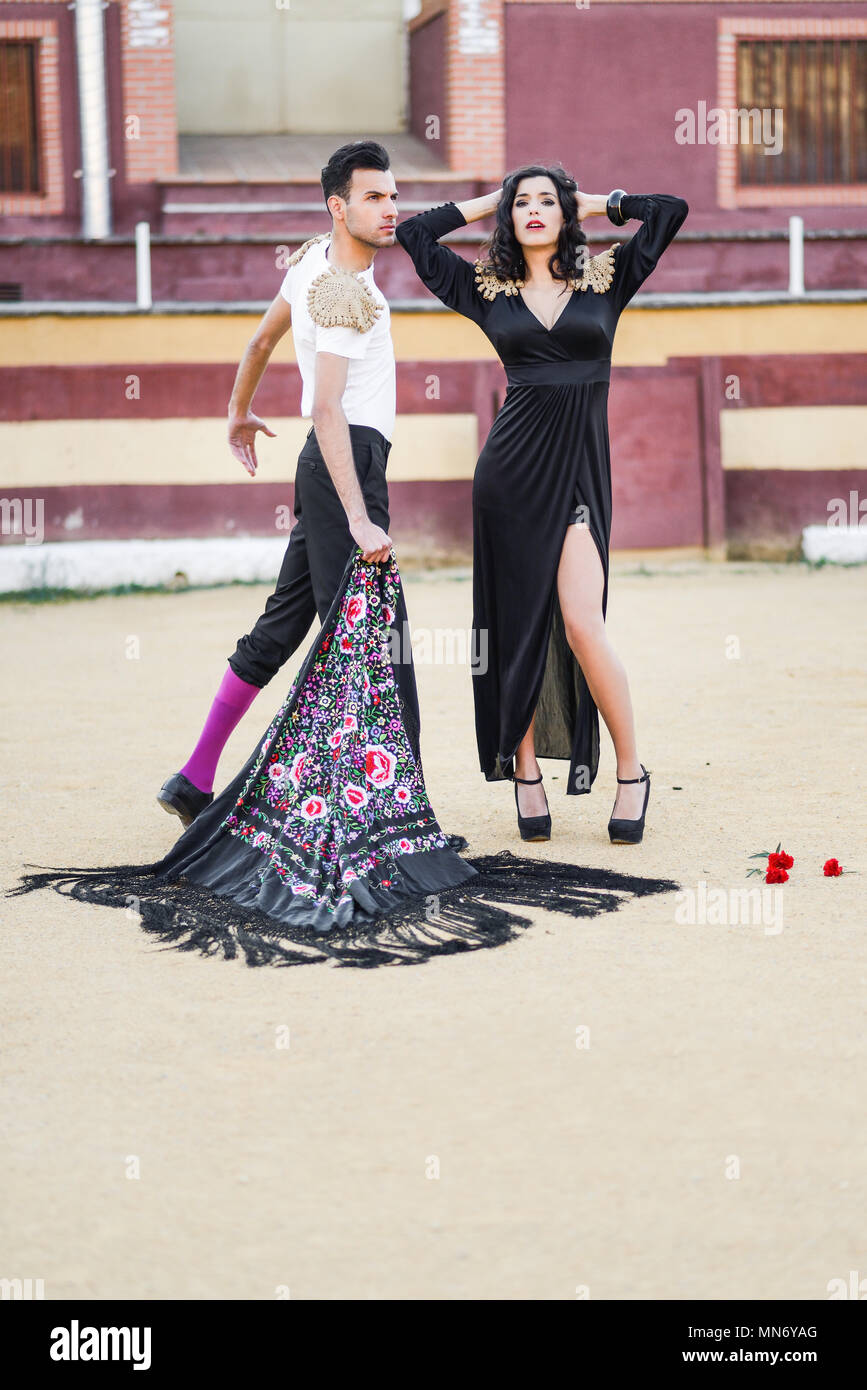 Portrait of a pretty couple, models of fashion, in a bullring. Spanish ...