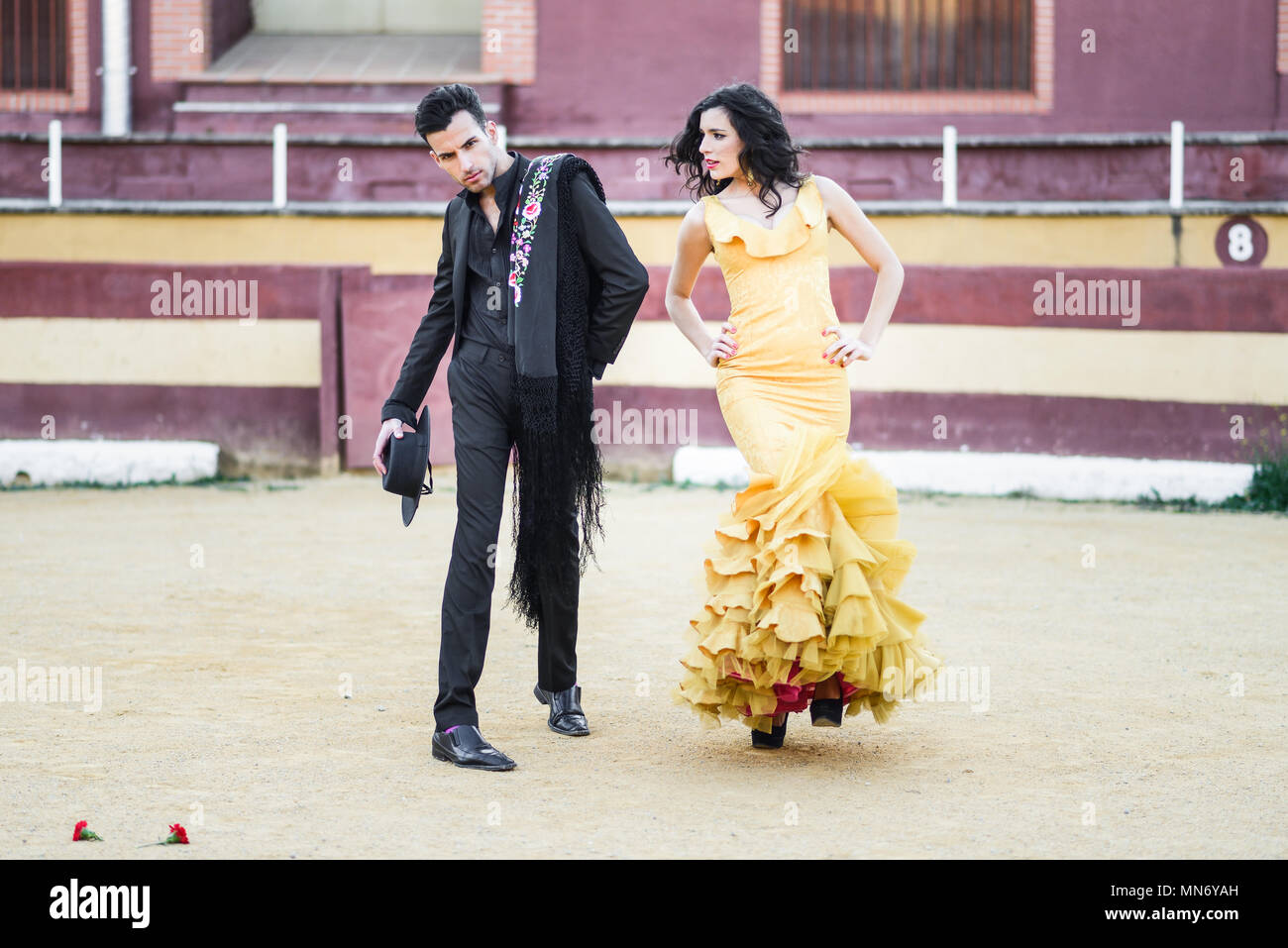 Portrait of a pretty couple, models of fashion, in a bullring. Spanish ...