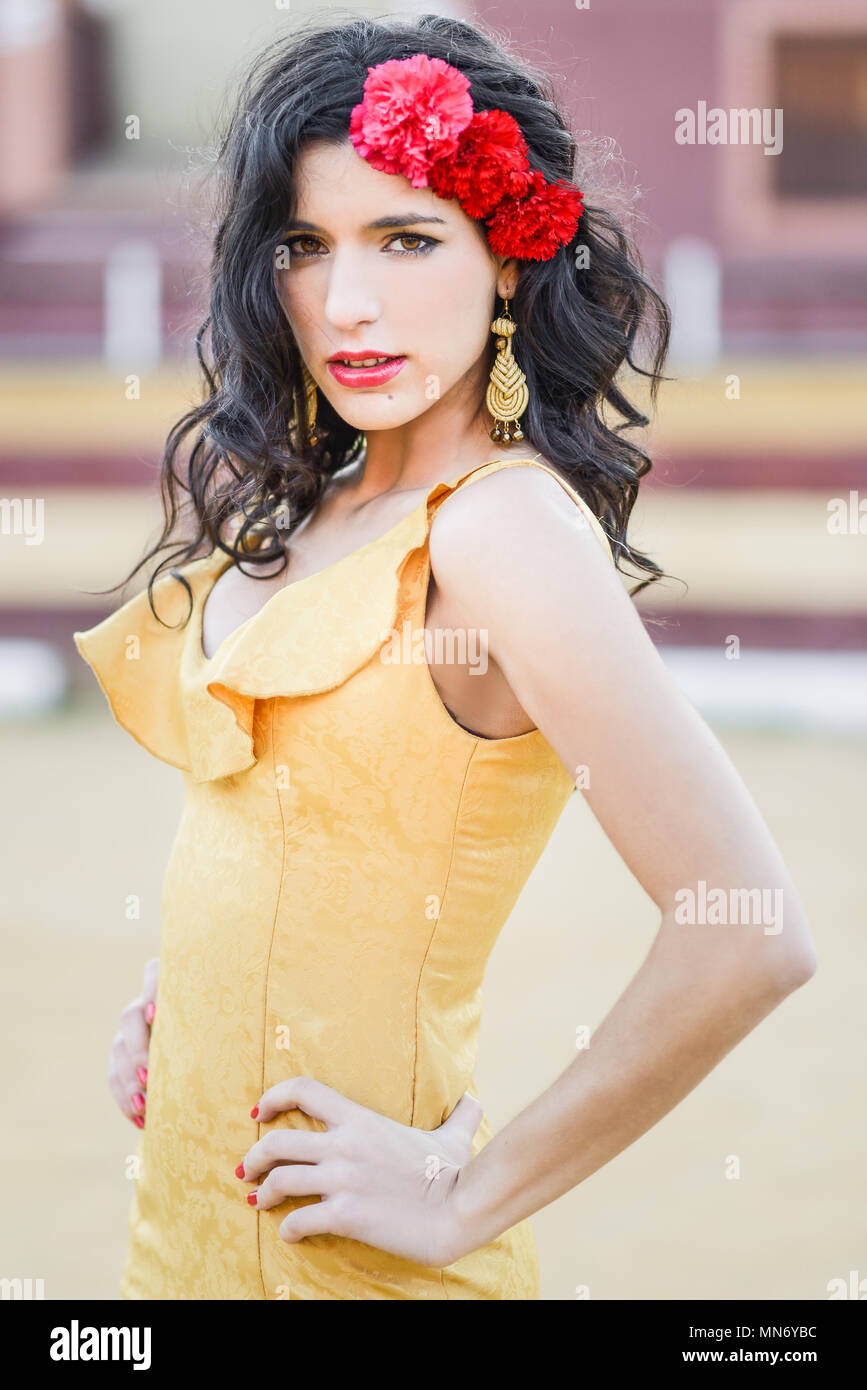 Portrait of a pretty woman, model of fashion, wearing a dress in a ...