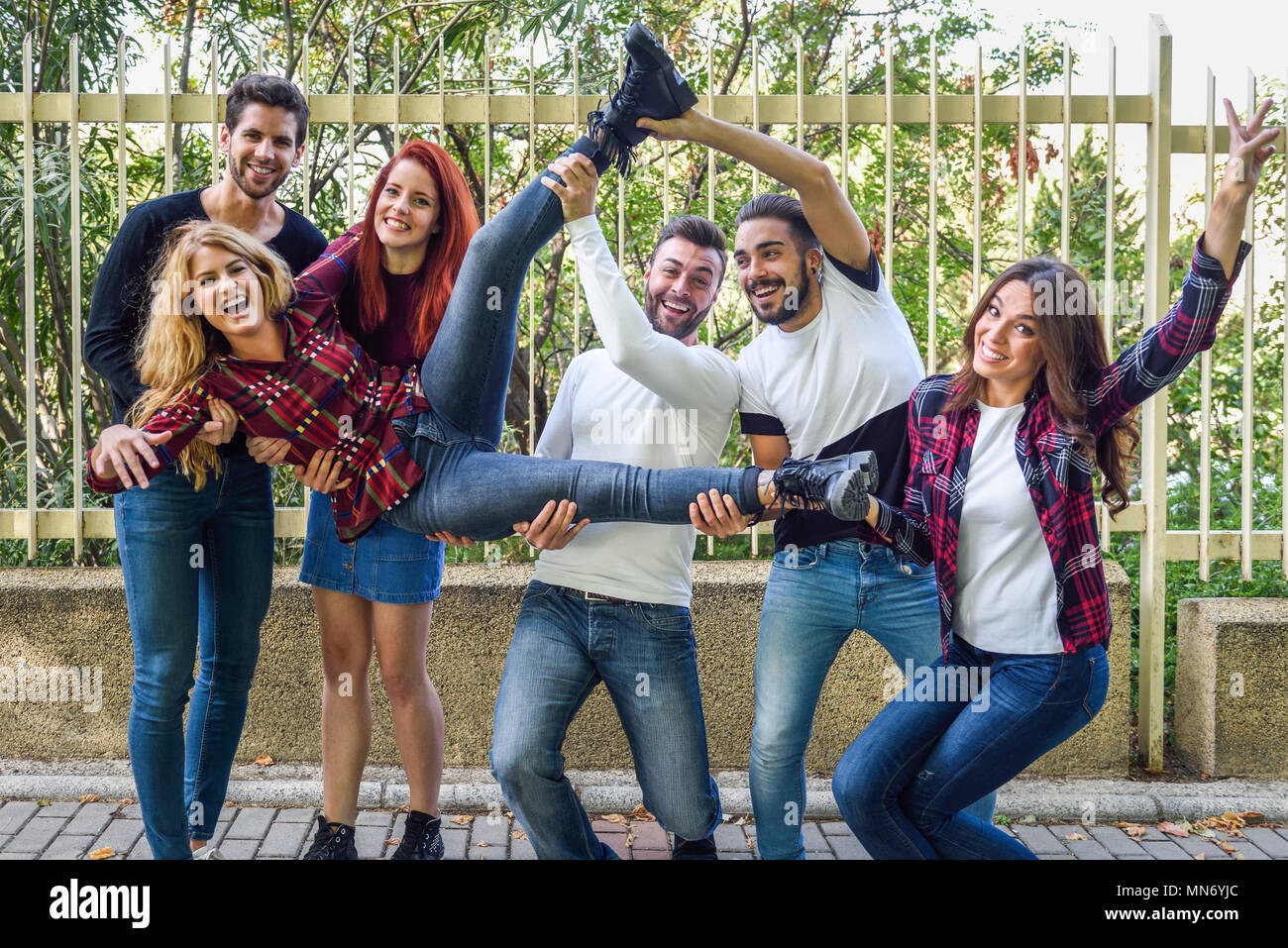 Group portrait of boys and girls with colorful fashionable clothes ...