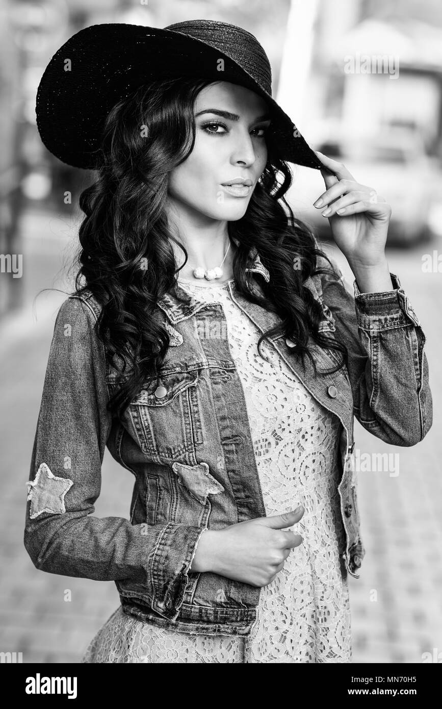 Young Brunette Woman Model Of Fashion Wearing Denim Jacket Hat And