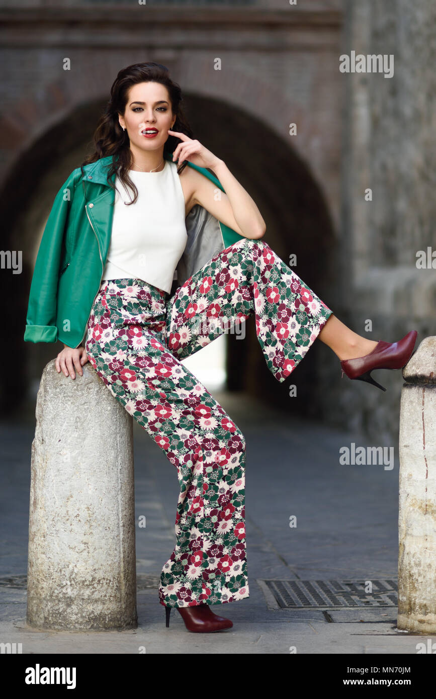 Young brunette woman, model of fashion, wearing green modern jacket and ...