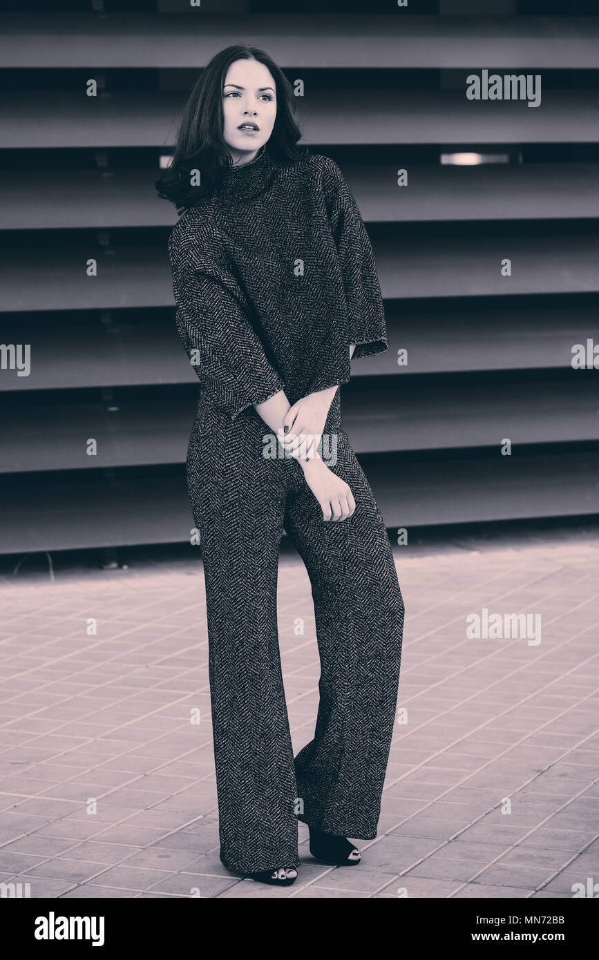 Beautiful young woman, model of fashion, in urban background Stock ...