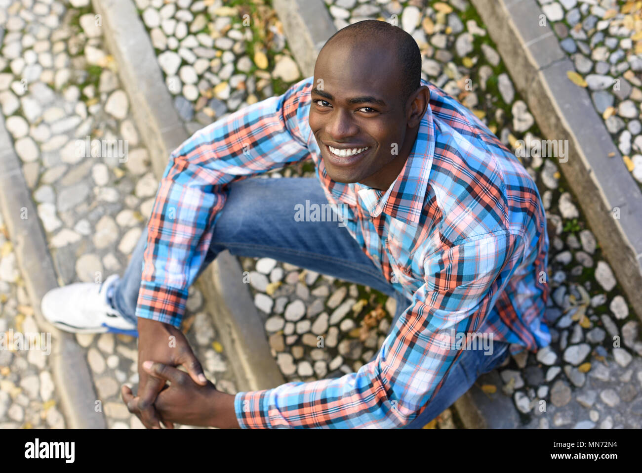 Portrait of black man very happy, smiling in urban background Stock ...