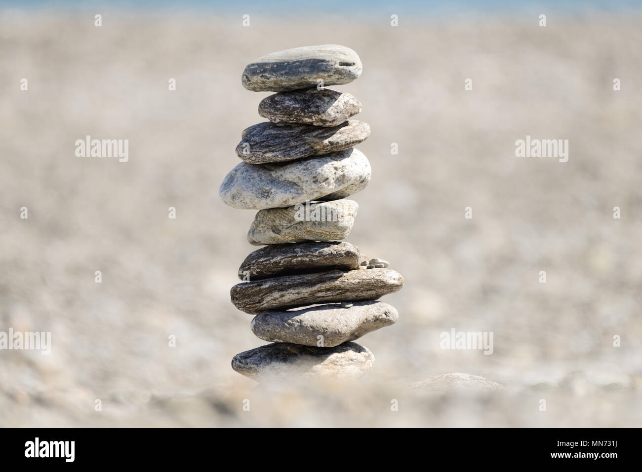 Pebbles in balancing on the sea coast Stock Photo - Alamy