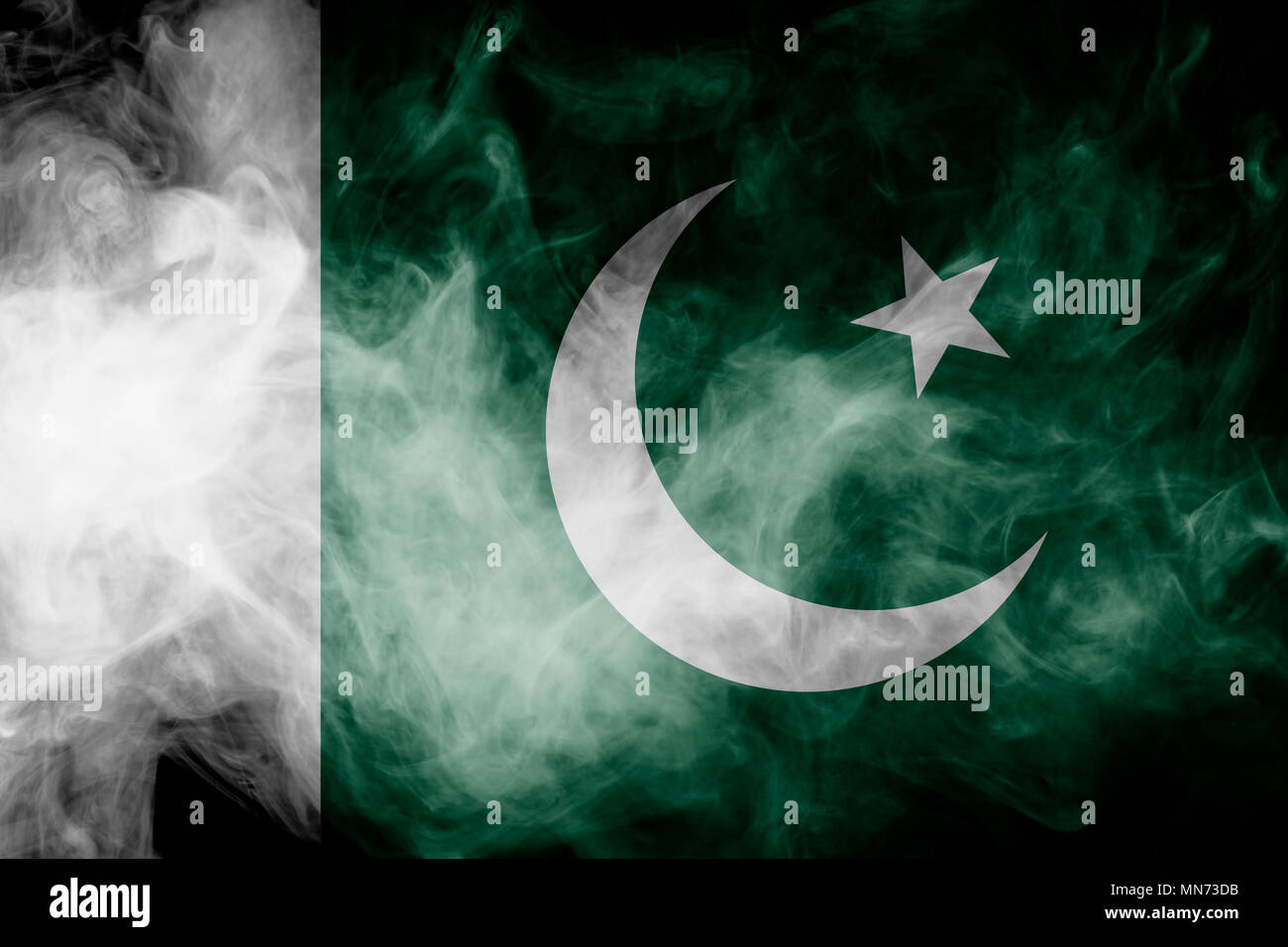 National flag of Pakistan from thick colored smoke on a black isolated ...